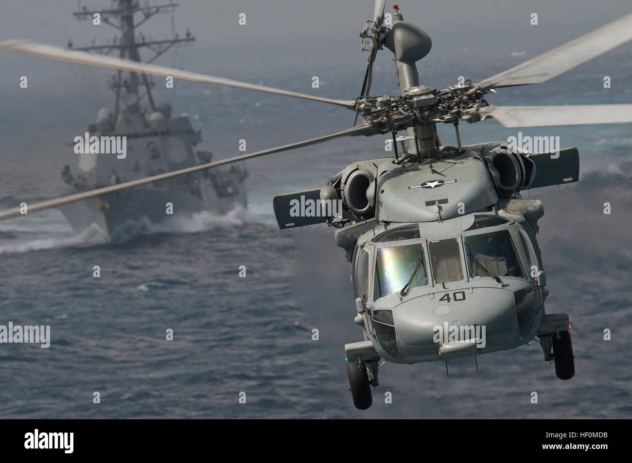 An MH-60S Knight Hawk helicopter conducted vertical replenishment at ...