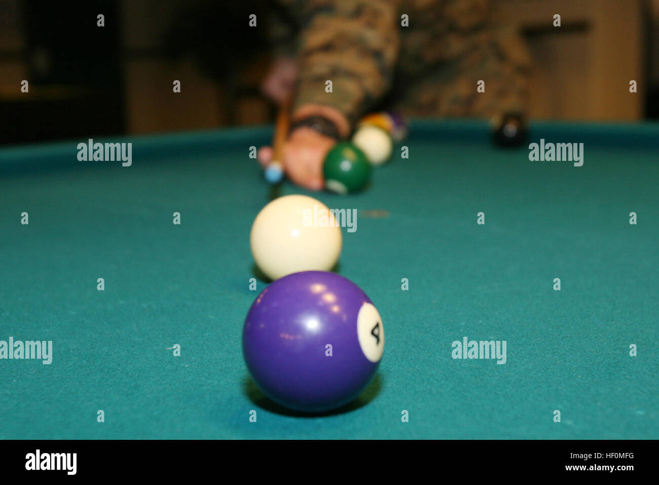 A Marine with Headquarters and Headquarters Squadron aims a shot Jan. 5 ...