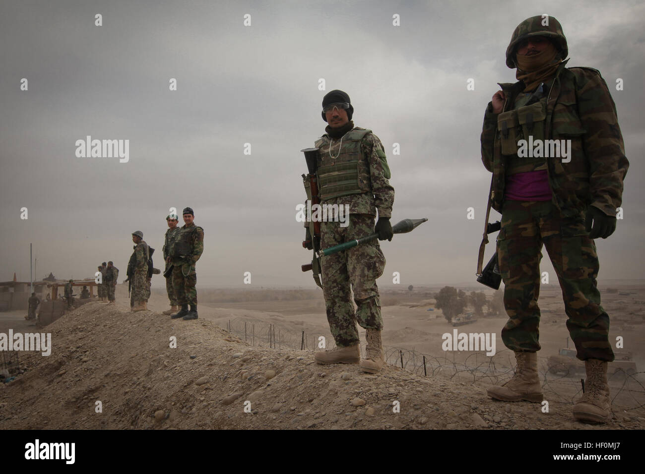 Afghan National Army soldiers patrol the berm at Artillery Hill, a ...