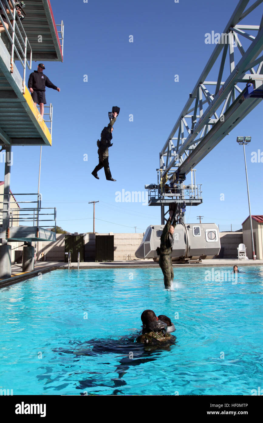 Japan Ground Self-Defense Force (JGSDF) soldiers jump into a pool to ...