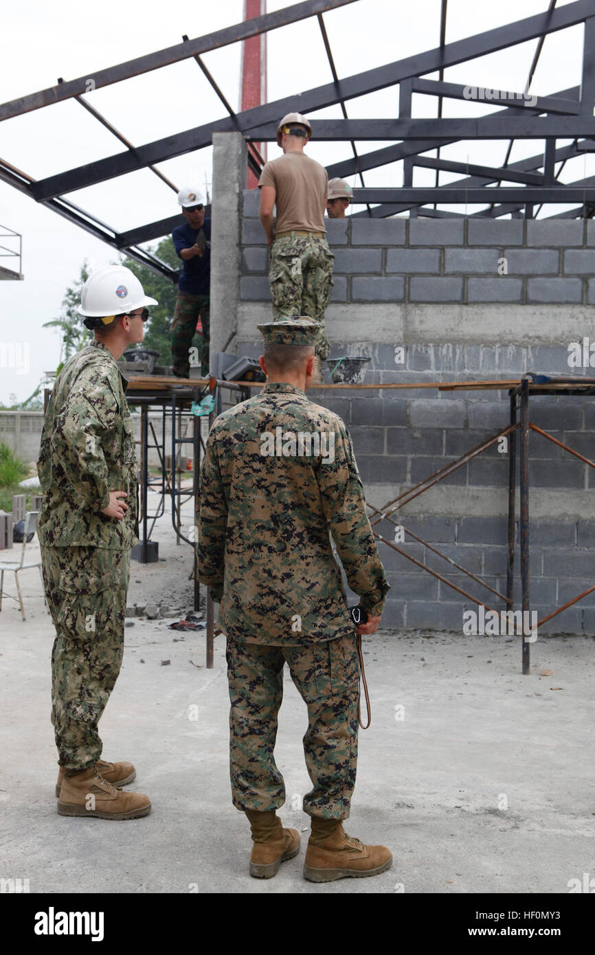 U.S. Navy Seabee Ensign Paul Naquin, site officer in charge, left ...