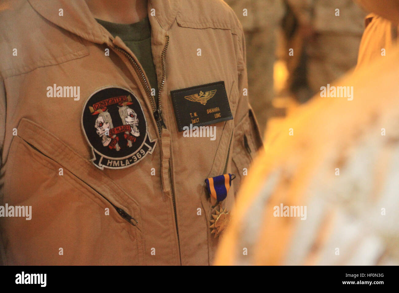 1st Lt. Timothy M. Sakahara, left, an AH-1W Super Cobra pilot with the ...