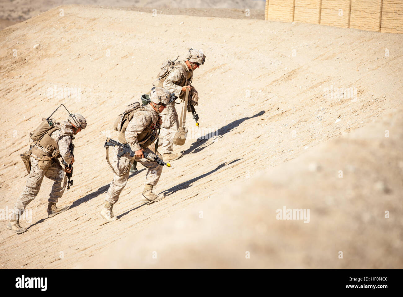 Marines with 3rd Battalion, 7th Marine Regiment, charge a hill on Range ...