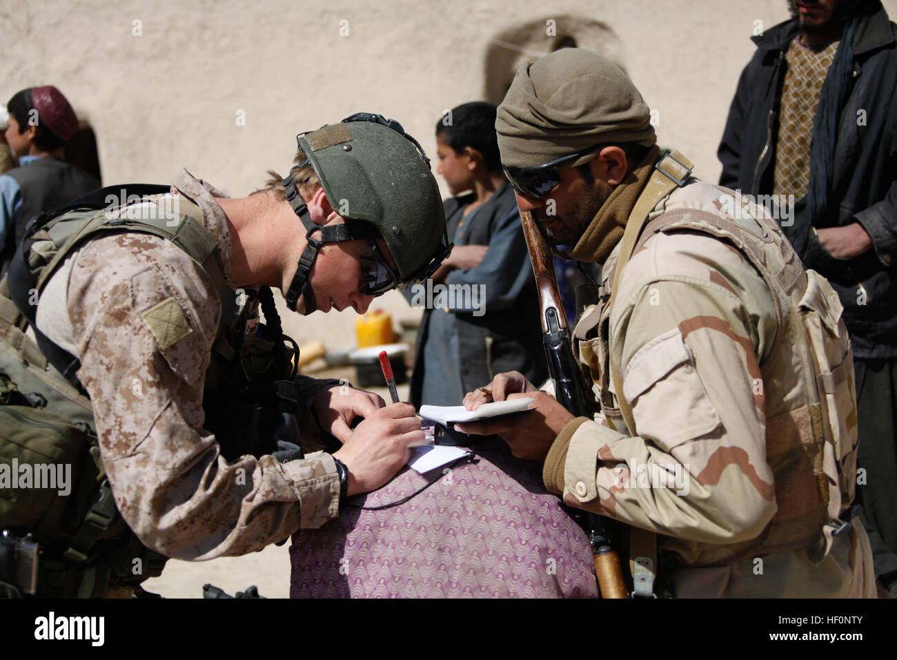 British Royal Marine Commando Lance Cpl. Alan Cahill, left foreground ...
