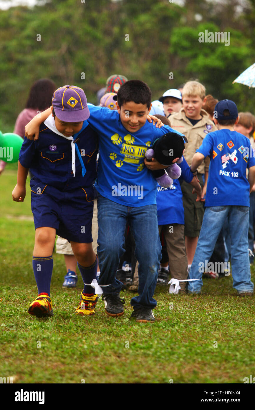 Boy scouts run a three-legged relay race during the 21st Friendship ...
