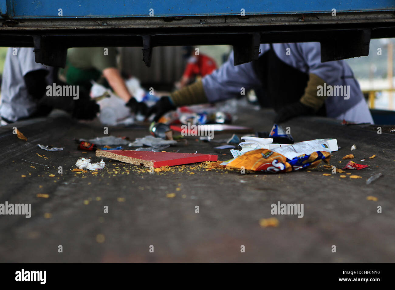 Marines and employees at Camp Pendleton's Recycling Center separate the ...