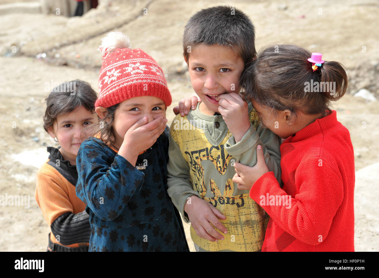 Afghan children play just outside a military base in Kabul, March 10 ...