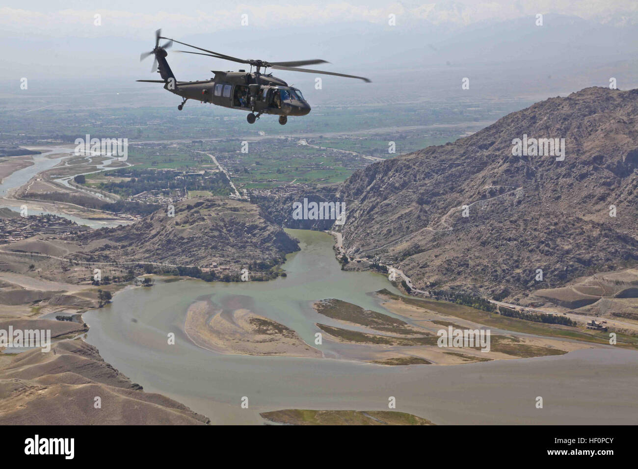 An U.S. Army UH-60 Black Hawk Helicopter is flying to Forward Operating ...