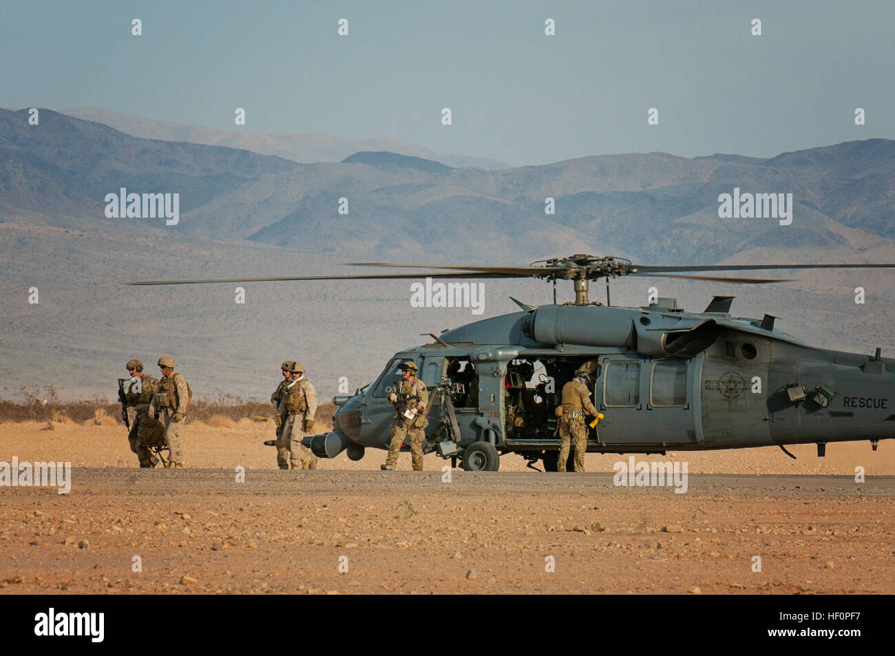 Pararescuemen from the 306th Rescue Squadron, U.S. Air Force, transport ...