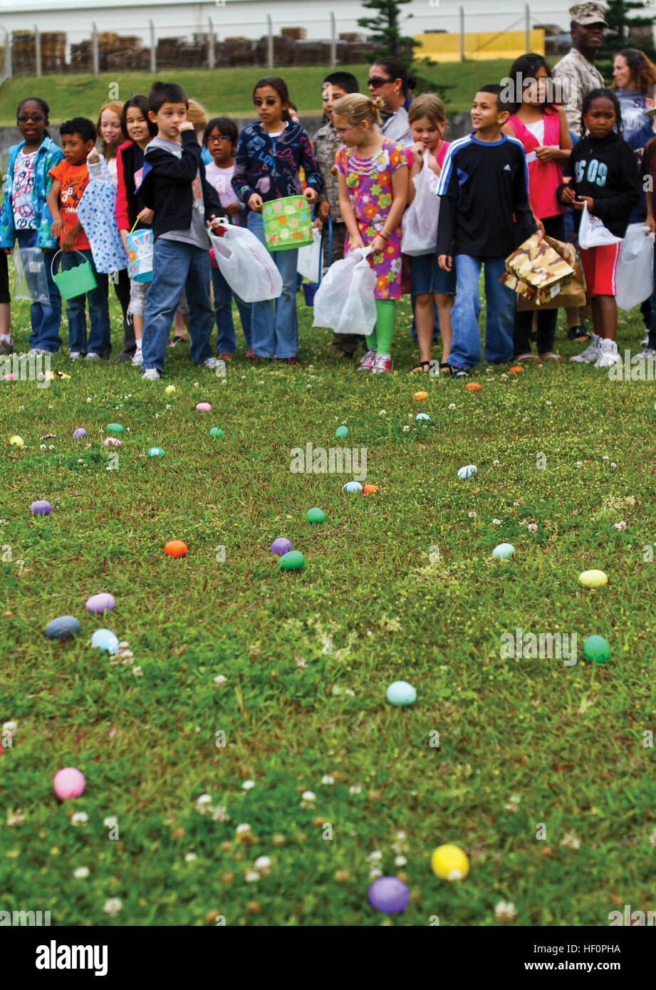 Children await the signal to begin during an Easter egg hunt at the ...