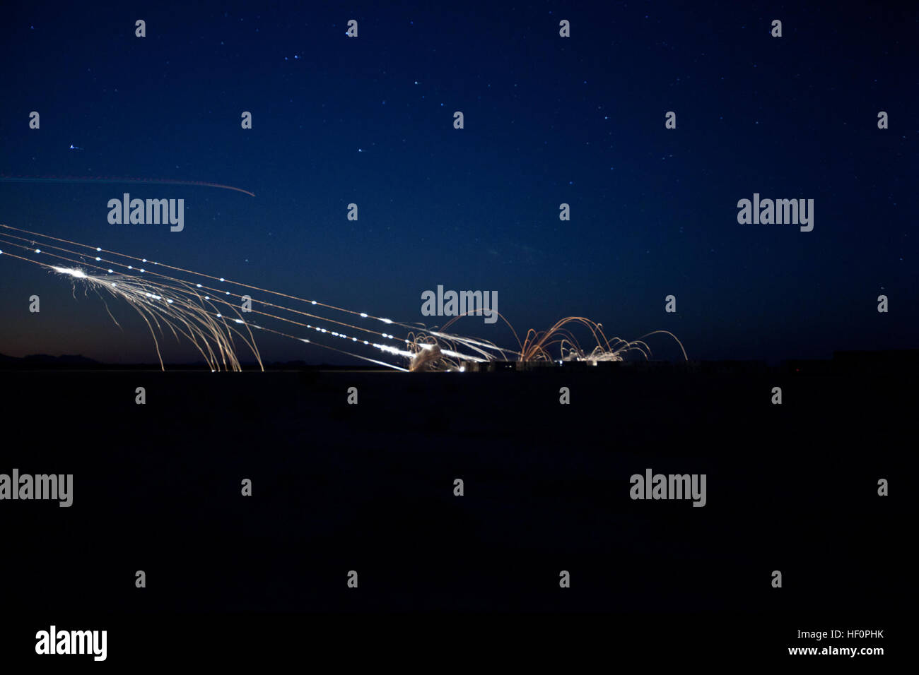 A U.S. Army AH-6 Little Bird helicopter engages targets at night for ...