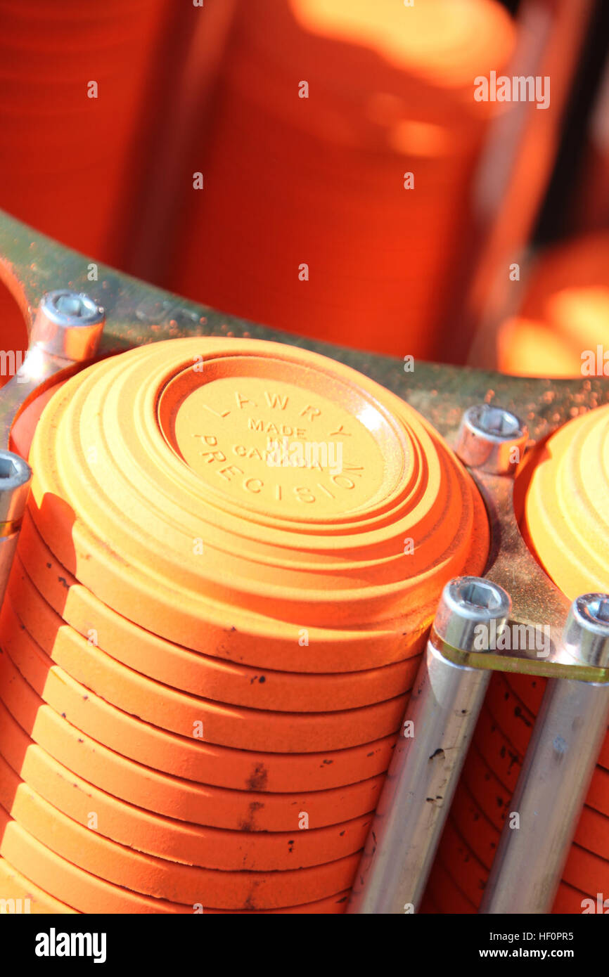 Stacks of clay pigeons are placed in a launcher used for trap shooting ...