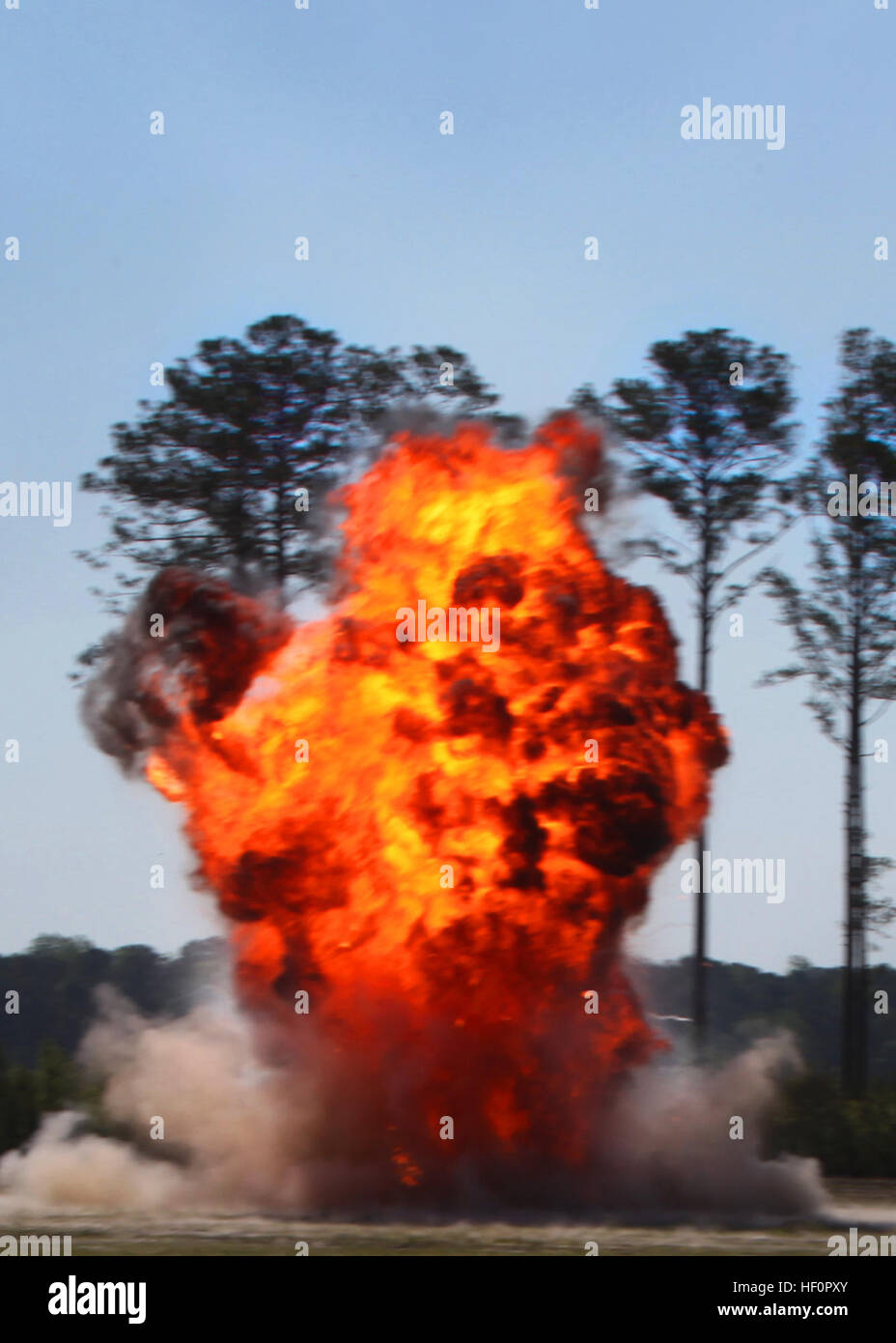 An explosion set off by explosive ordnance disposal Marines creating a ...