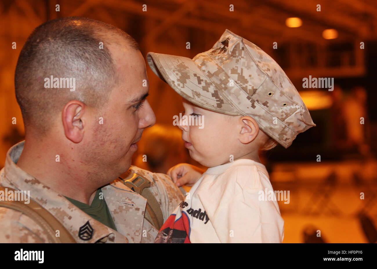 Staff Sgt. Reginald S. Hart holds his son Landyn, 17-month-old, after ...