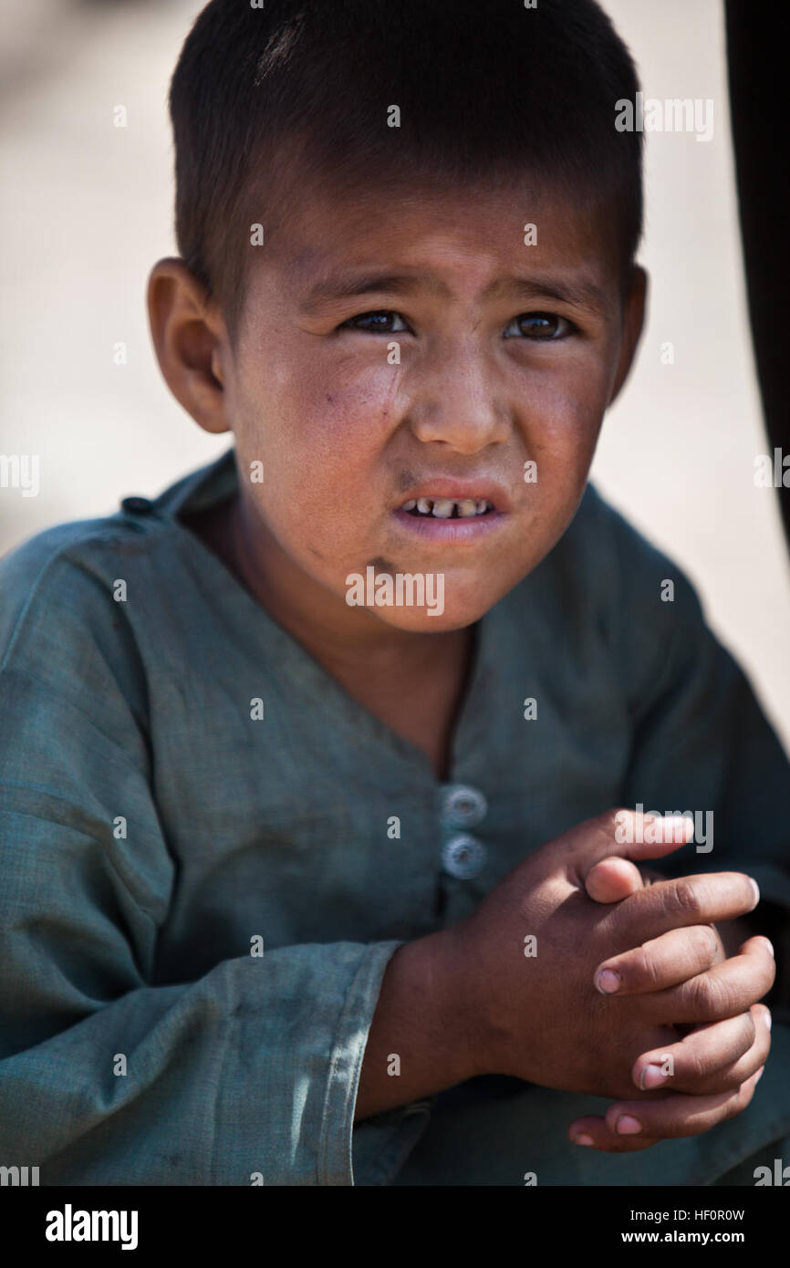 A young Afghan boy poses for the camera during a shura in Sheik Abad ...