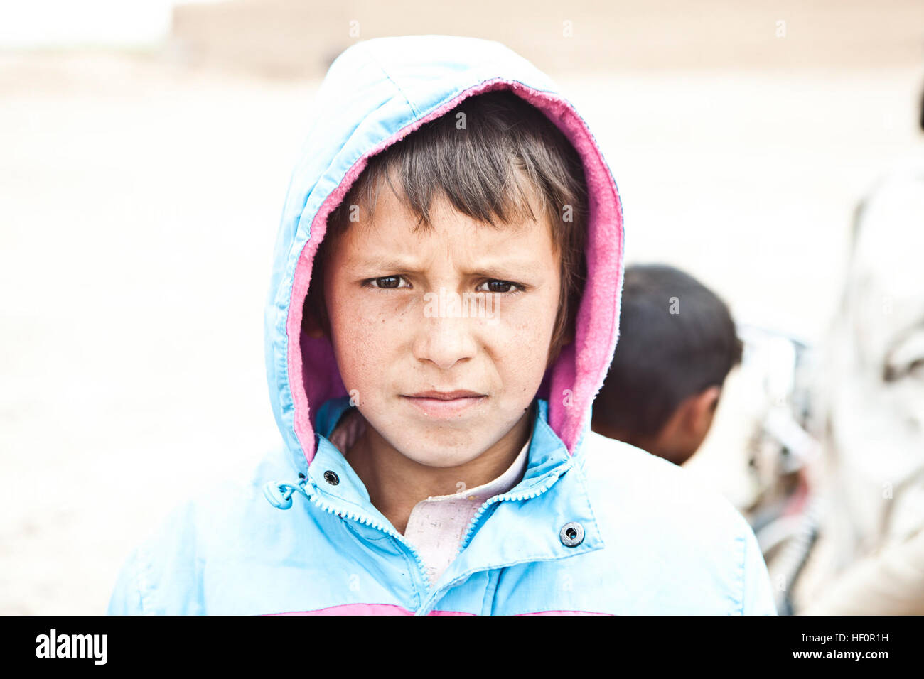An Afghan boy poses for the camera during a shura in Sheik Abad ...