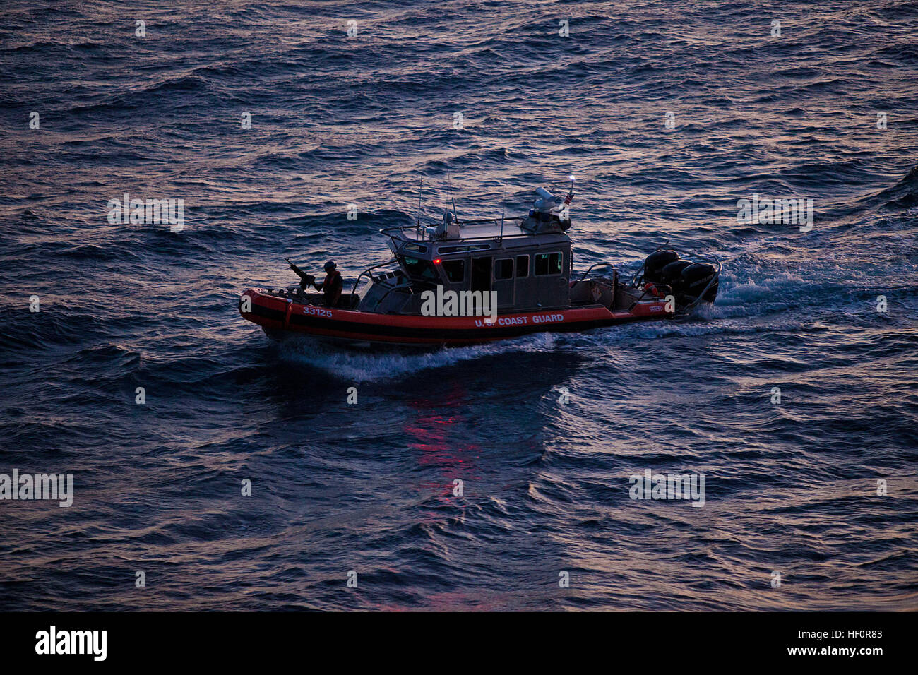 A U.S. Coast Guard patrol boat provides security for USS Wasp while ...