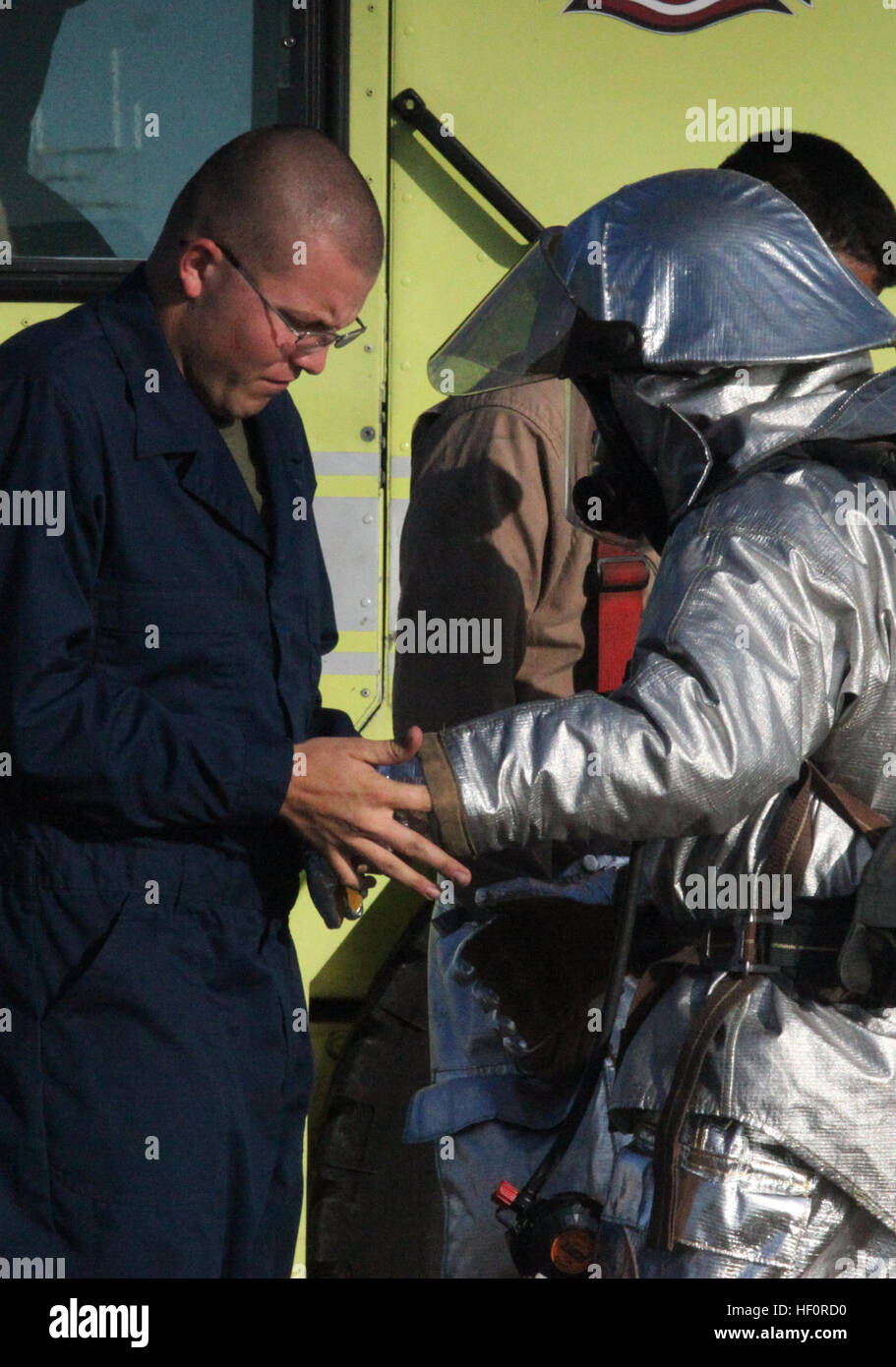 Aircraft Rescue and Firefighting Marines check gear before beginning ...