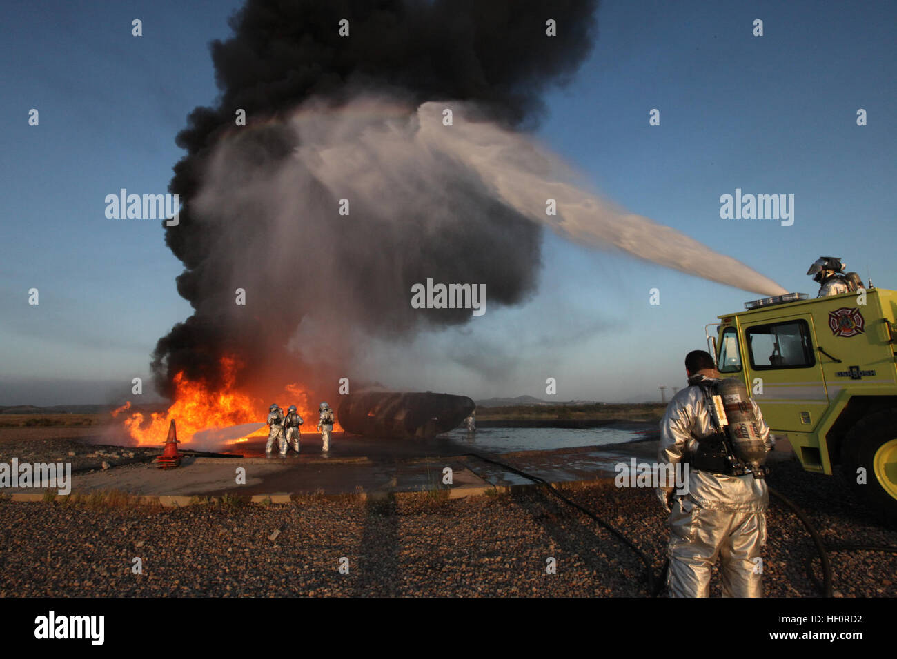 Aircraft Rescue and Firefighting Marines extinguish a fire during a ...