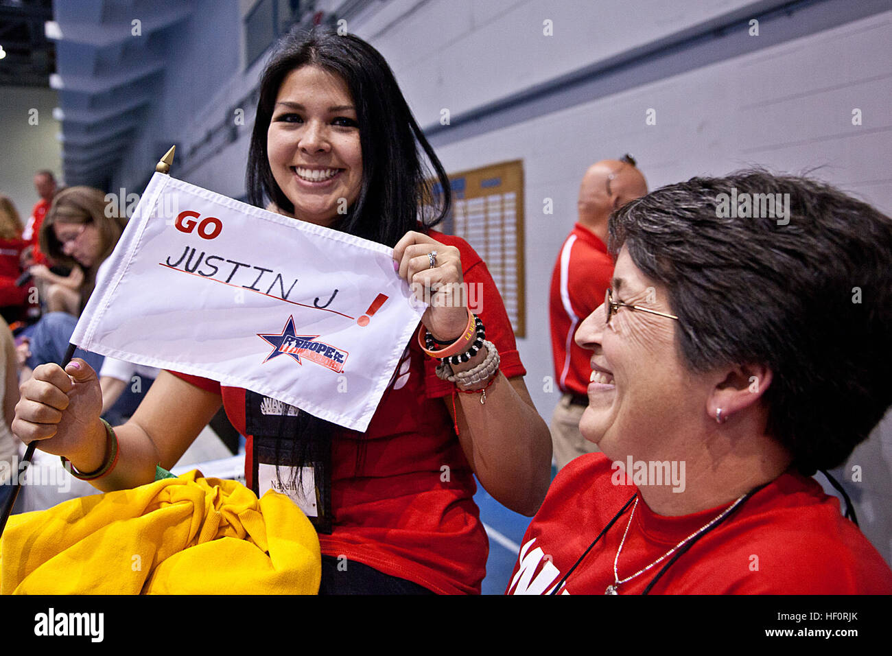 Cpl. Justin Jones' mother, Leigh Jones, and wife, Nayelli, watch while ...