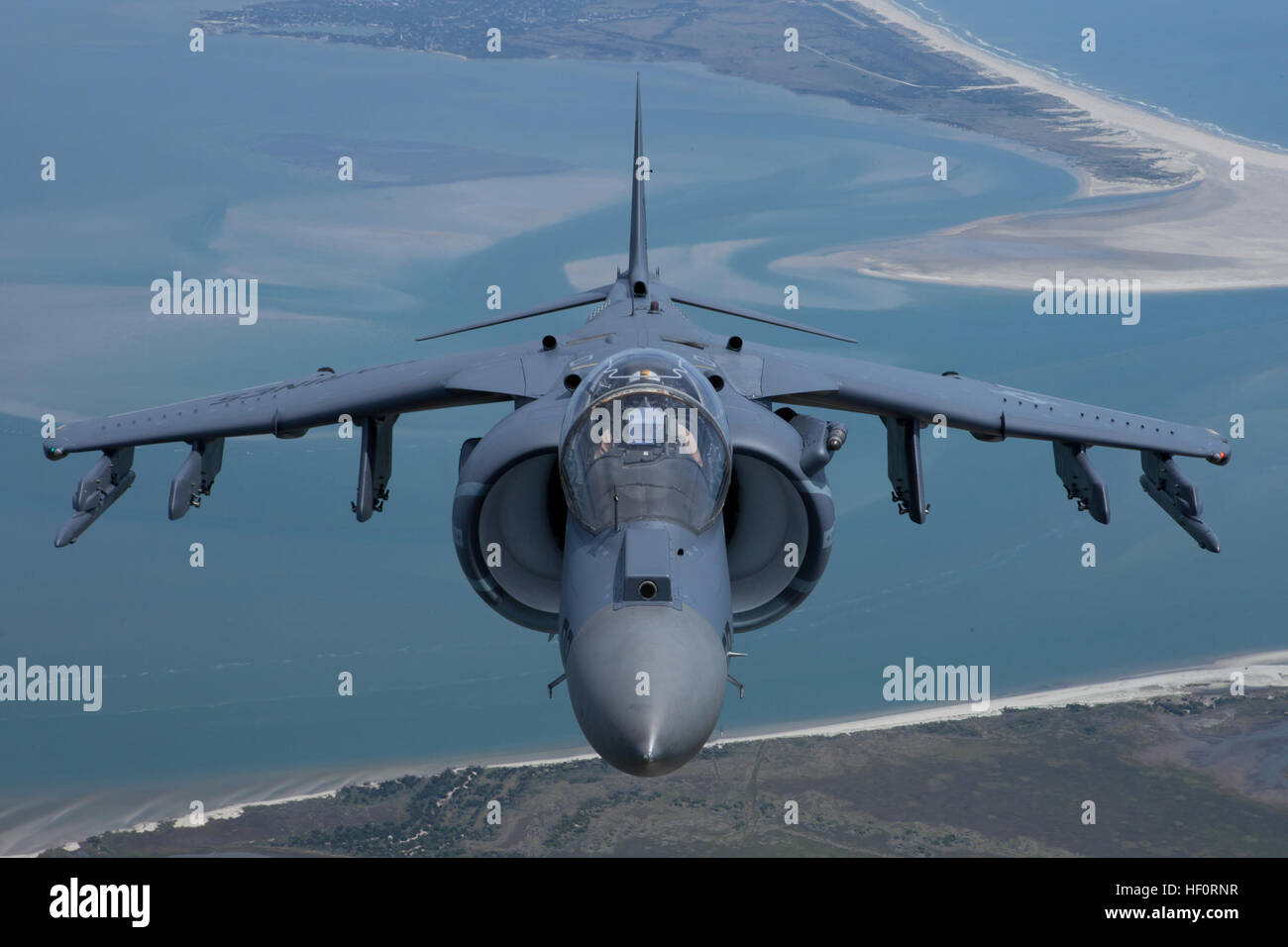 A Marine Corps AV8 Harrier performs a legacy flight symbolizing the ...