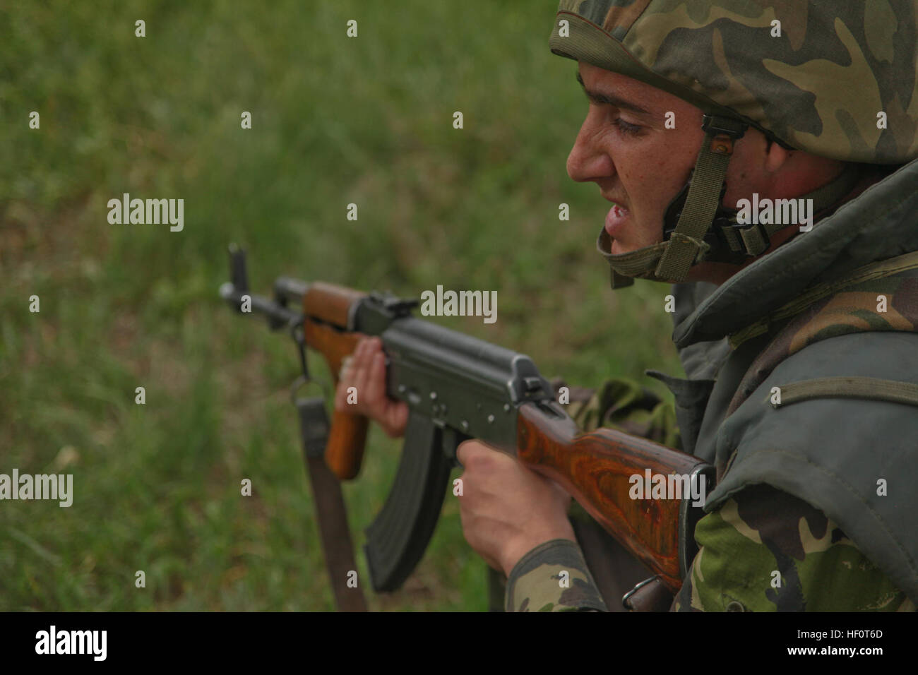 IASI, Romania – A Romanian soldier searches for mock enemy while on a ...