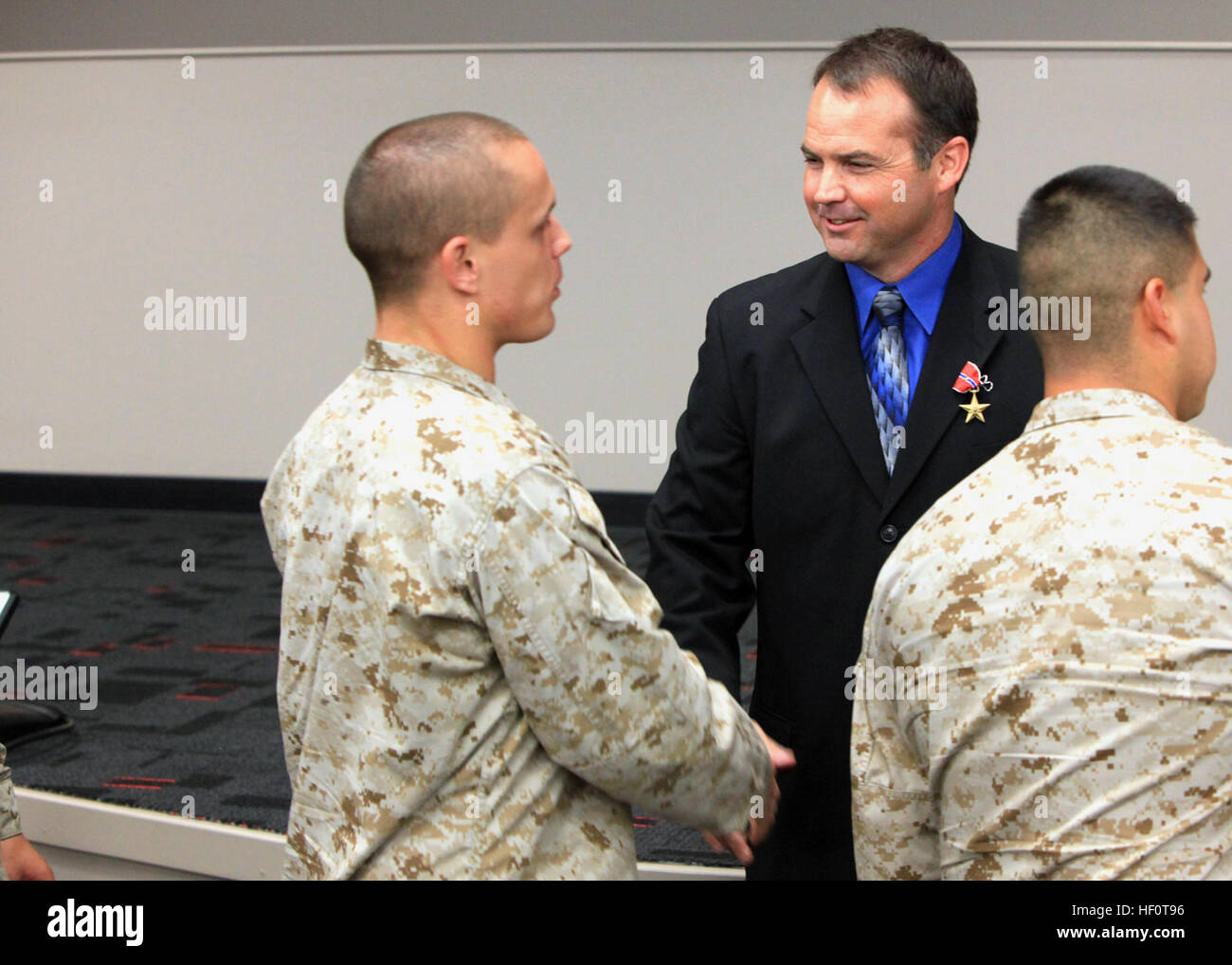 A Marine with 1st Marine Special Operations Battalion congratulates ...