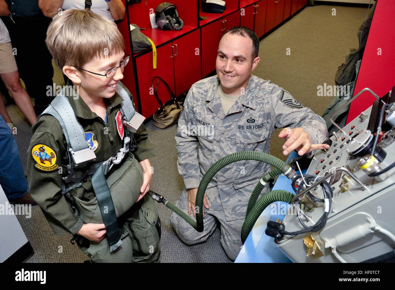 Life Support Technician, Master Sergeant Timothy Gonzales inflates the ...
