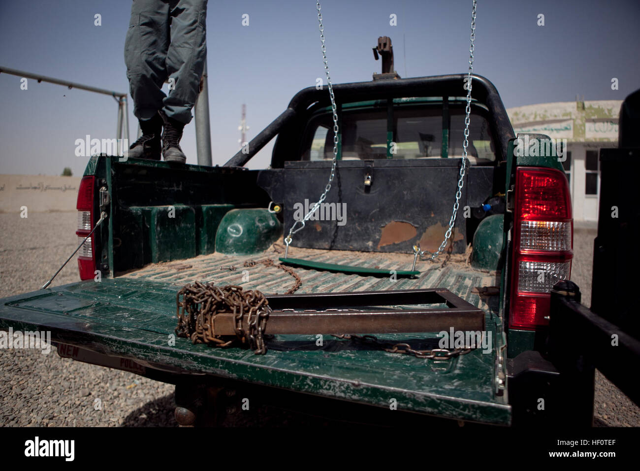 An old, broken swing sits on the tailgate of an Afghan Uniformed Police ...