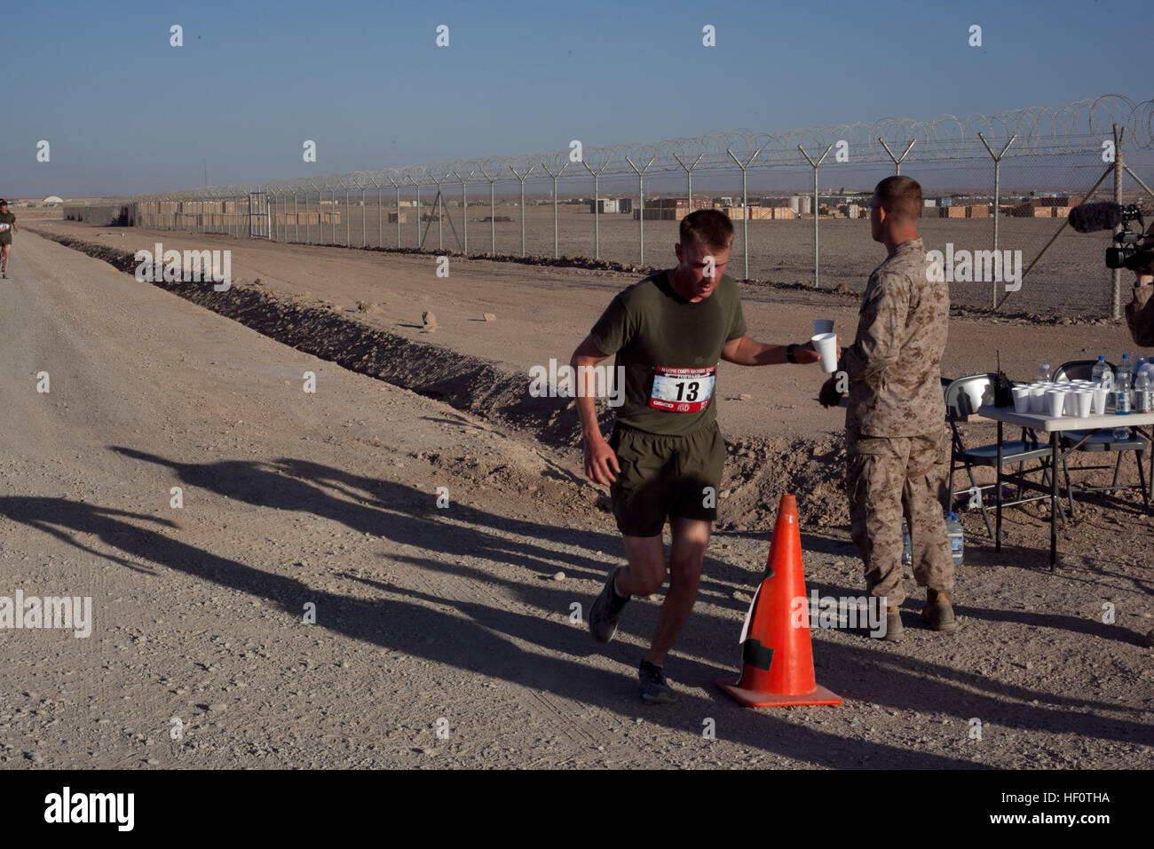 First Lt. Michael Manson grabs a cup of water during the shadow version ...