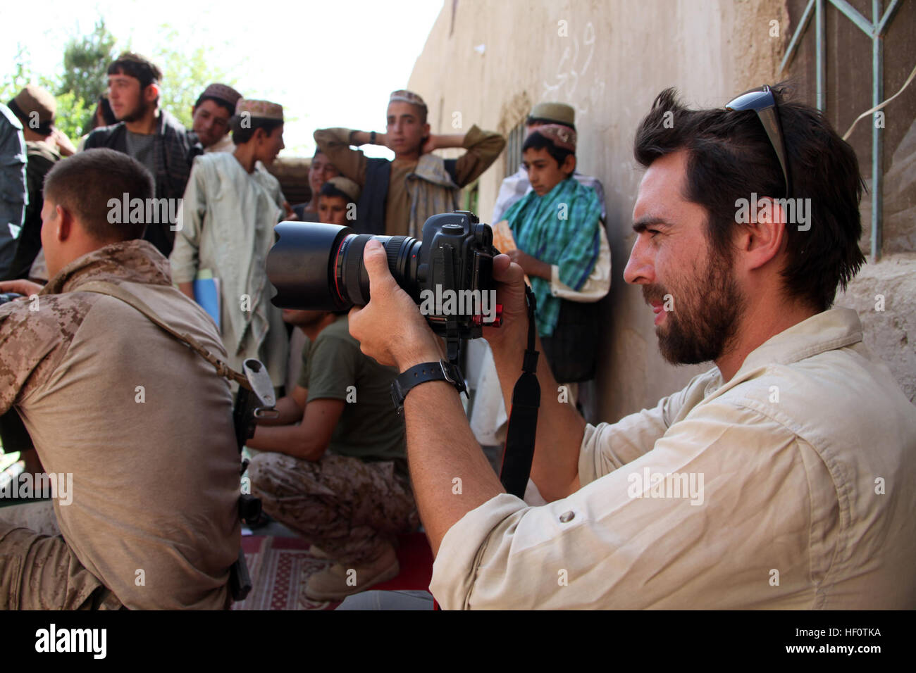 Ben Foley, right, cameraman, with Al Jazeera English News Channel ...