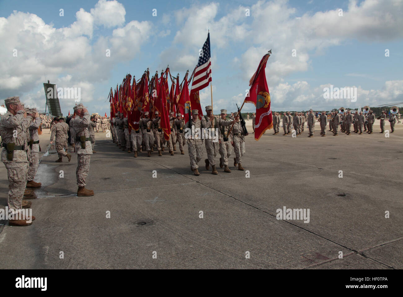 A platoon of 2nd Marine Aircraft Wing Marines pass and salute current ...