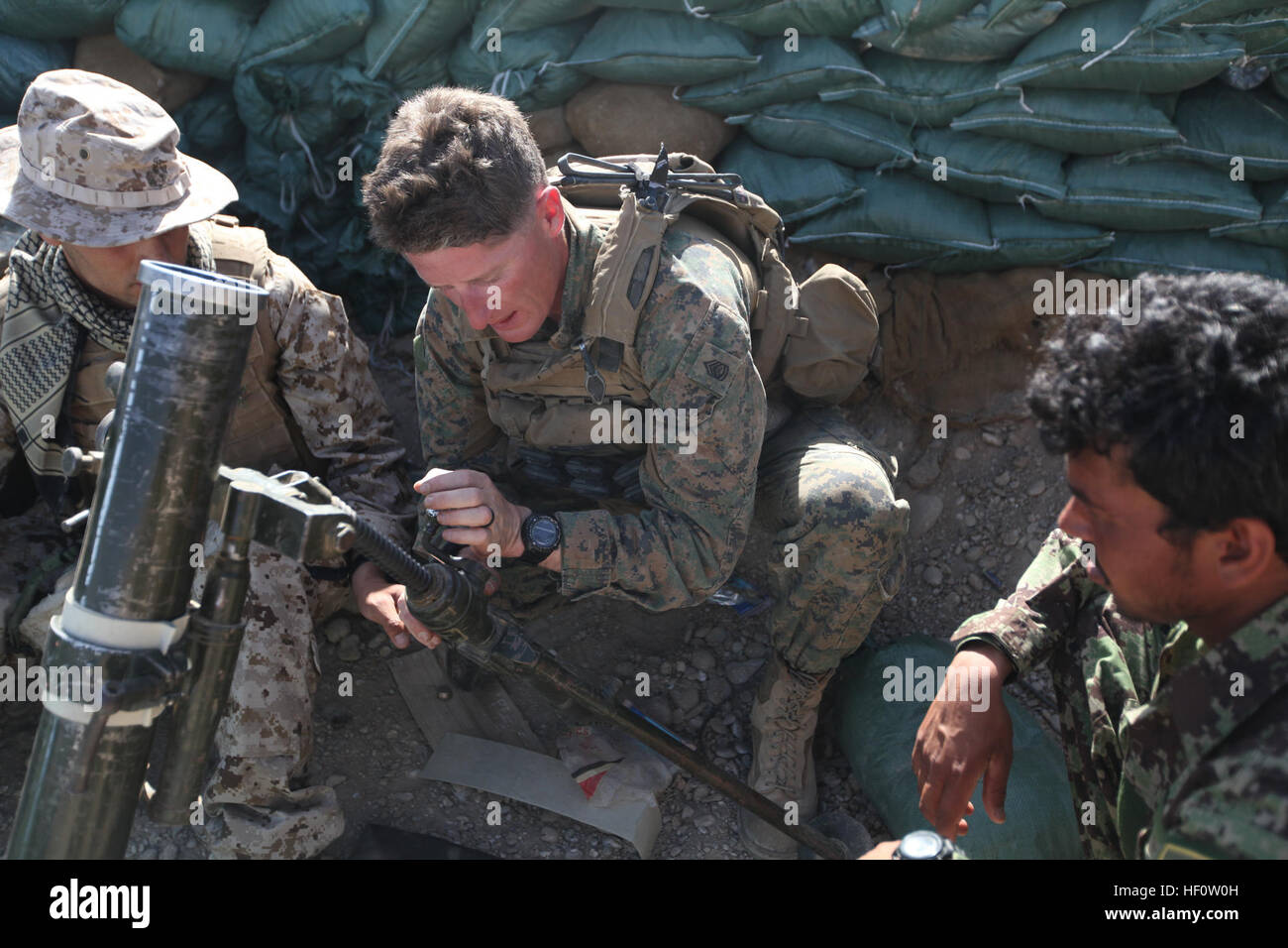 U.S. Marine Corps Gunnery Sgt. Andrew Darnell, center, with Advisor ...