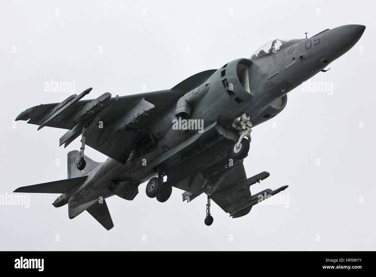 An AV-8B Harrier lands on the flight deck of the USS Peleliu during ...