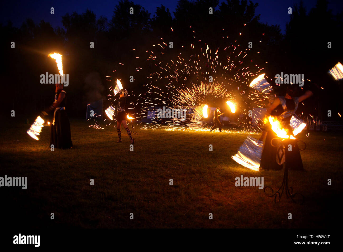 Medieval re-enactors perform a "fire dance" during a demonstration ...