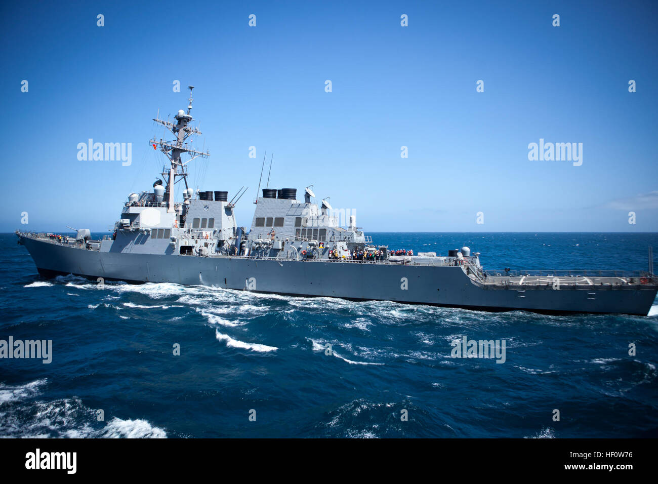 U.S. Naval Ship USS Harris floats by the USS Peleliu during a ship to ...