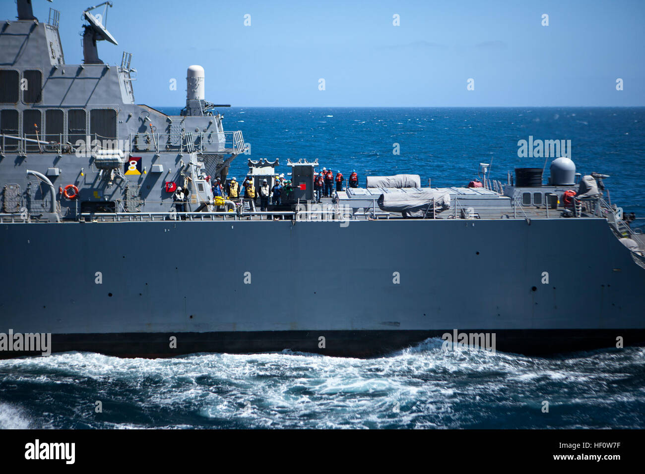 U.S. Naval Ship USS Harris floats by the USS Peleliu during a ship to ...