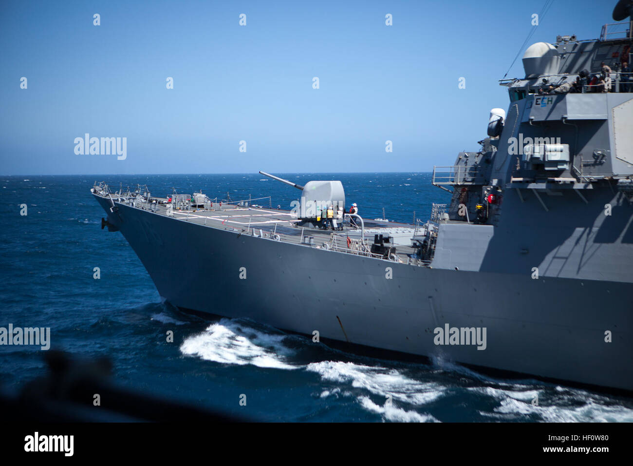 U.S. Naval Ship USS Harris floats by the USS Peleliu during a ship to ...