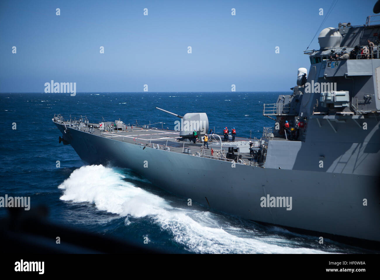 U.S. Naval Ship USS Harris floats by the USS Peleliu during a ship to ...