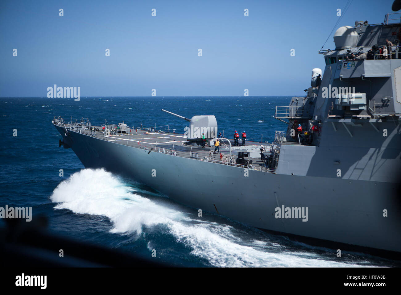 U.S. Naval Ship USS Harris floats by the USS Peleliu during a ship to ...