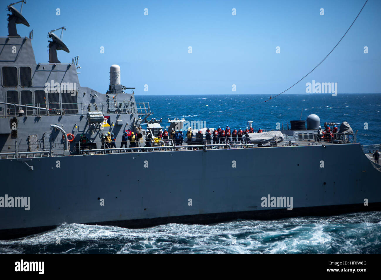 USS Harris and USS Peleliu conduct a ship-to-ship refueling exercise to ...