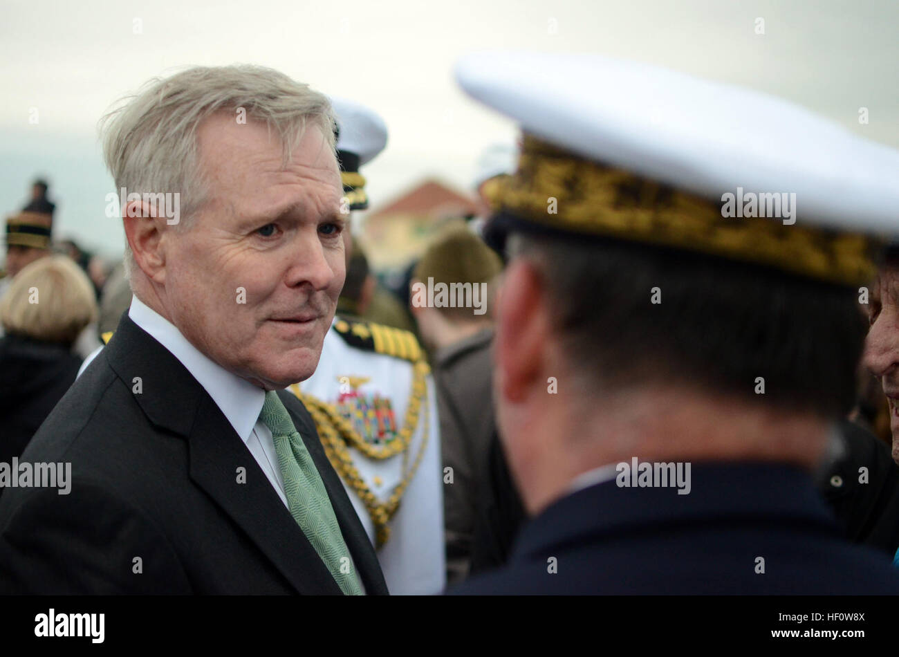U.S. Secretary of the Navy Ray Mabus shakes hands with foreign naval ...