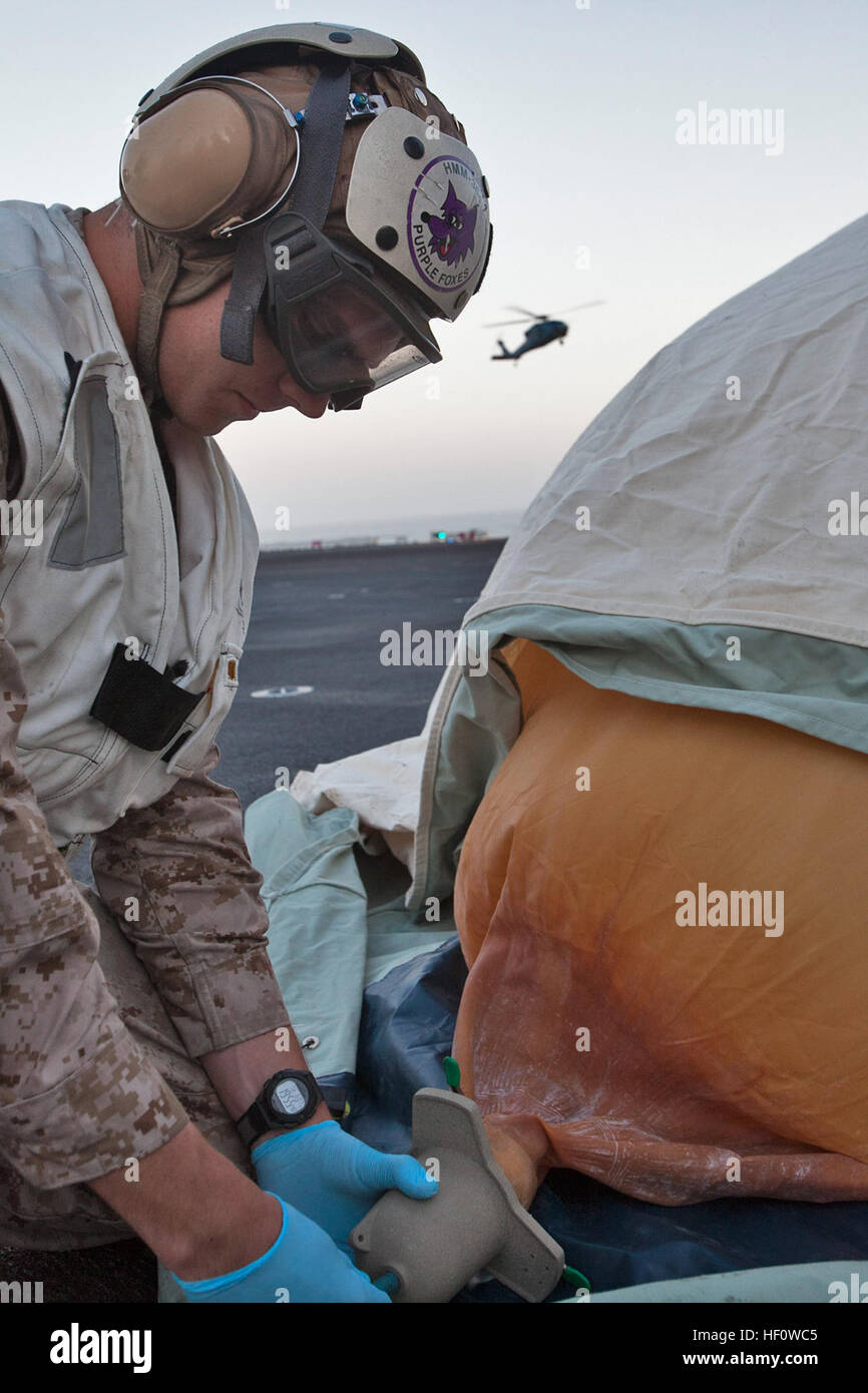 Private 1st Class operates a Combat SkySat system aboard USS Peleliu to ...