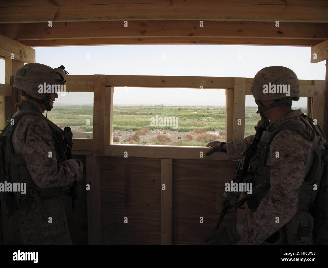 Two U.S. Marines with Charlie Company, 3D Light Armored Reconnaissance ...