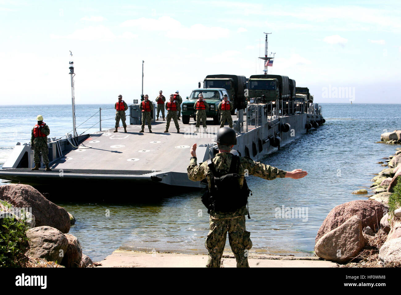 U.S. Navy Quartermaster 2nd Class John Gosewisch, foreground, a salvage ...