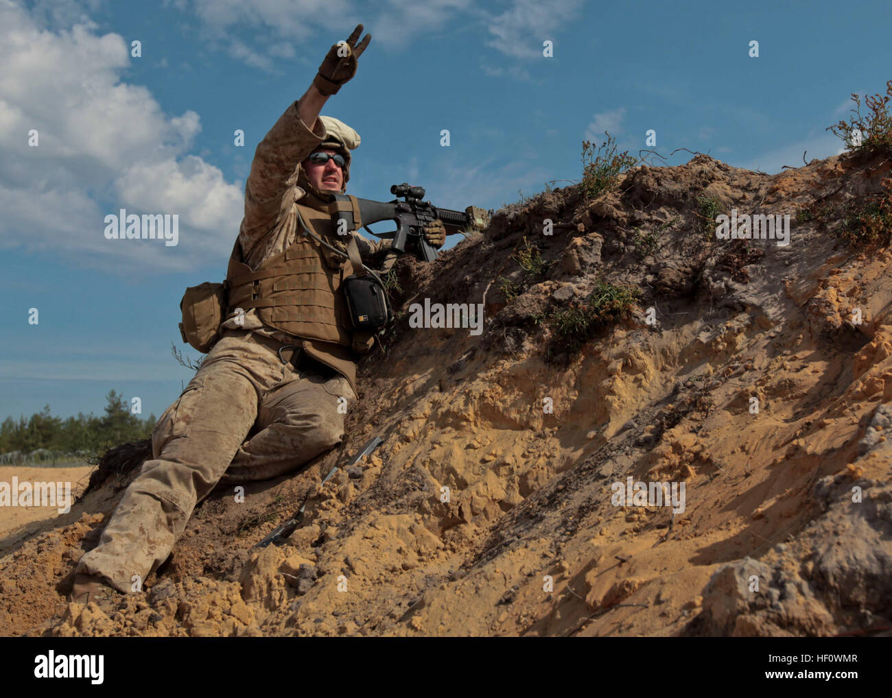 U.S. Marine signals for two magazines during Saber Strike 2012, a ...