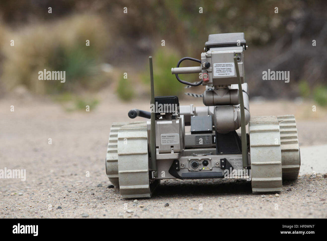 A robot is used for reconnaissance to find and clear improvised ...