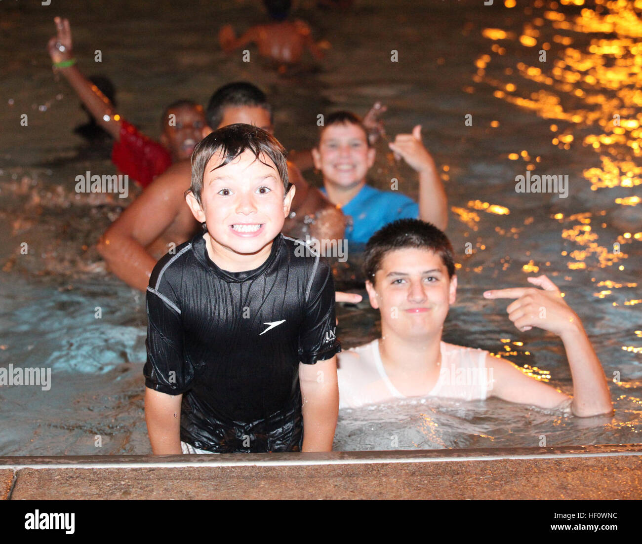 Children swim during the Summer Pool Party hosted by Marine Corps ...