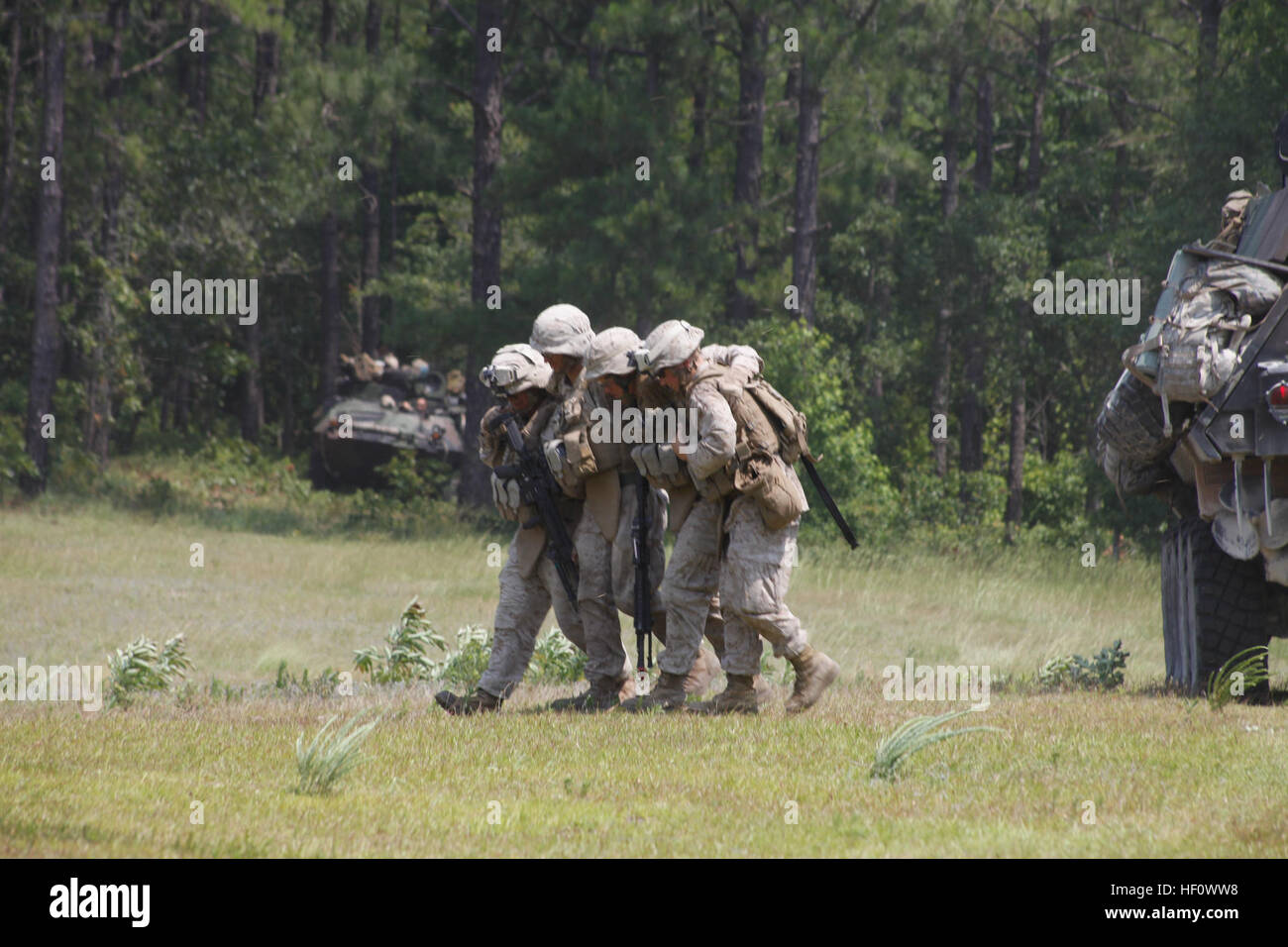 Marines with Company D, 2nd Light Armored Reconnaissance Battalion aid ...