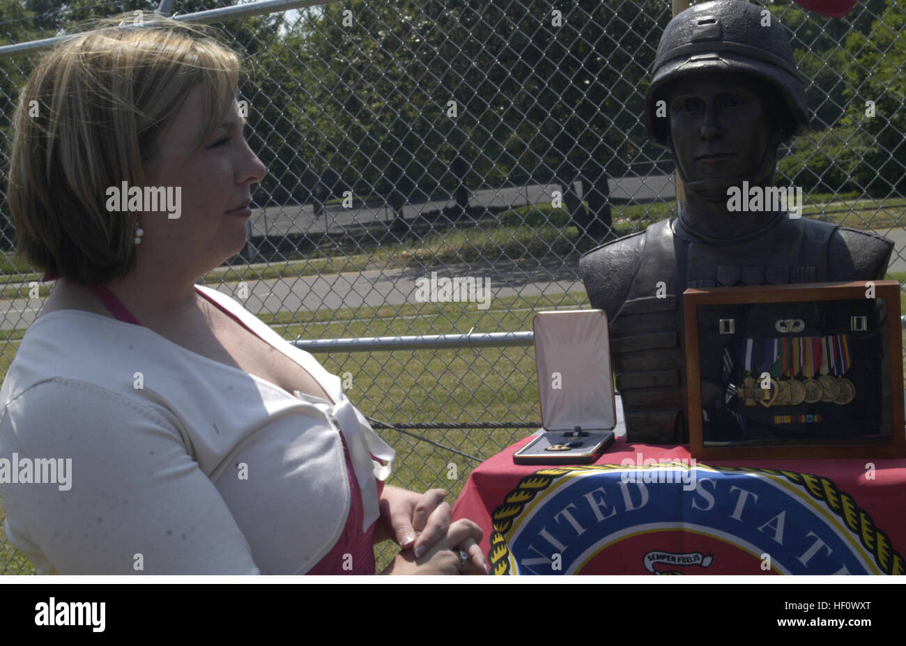 Amy Morel, wife of Capt. Brent L. Morel, stares into the bronze statue ...